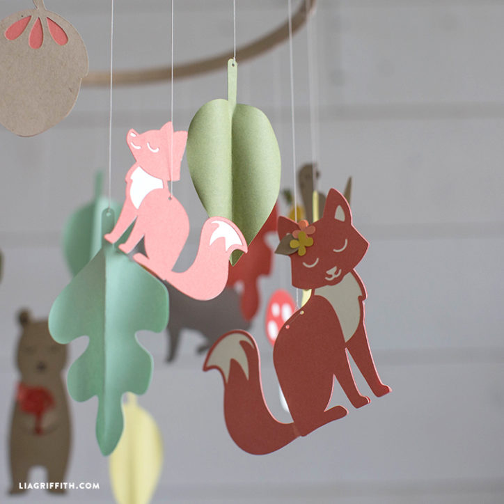 Create a simple papercut woodland baby mobile
